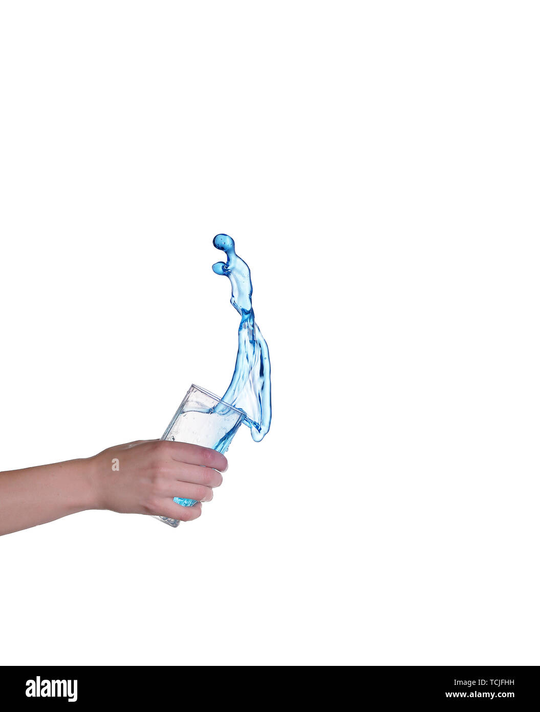 Blue water splashing in glass held by hand, white background Stock ...