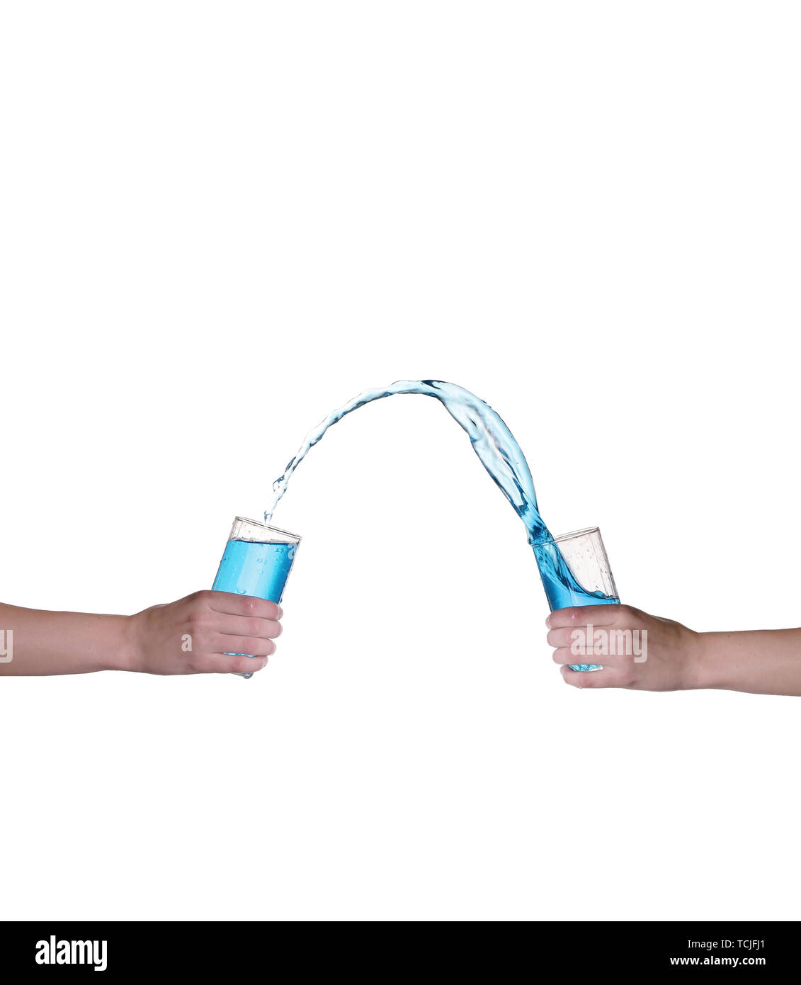 Blue water splashing in glass held by hand, white background Stock ...
