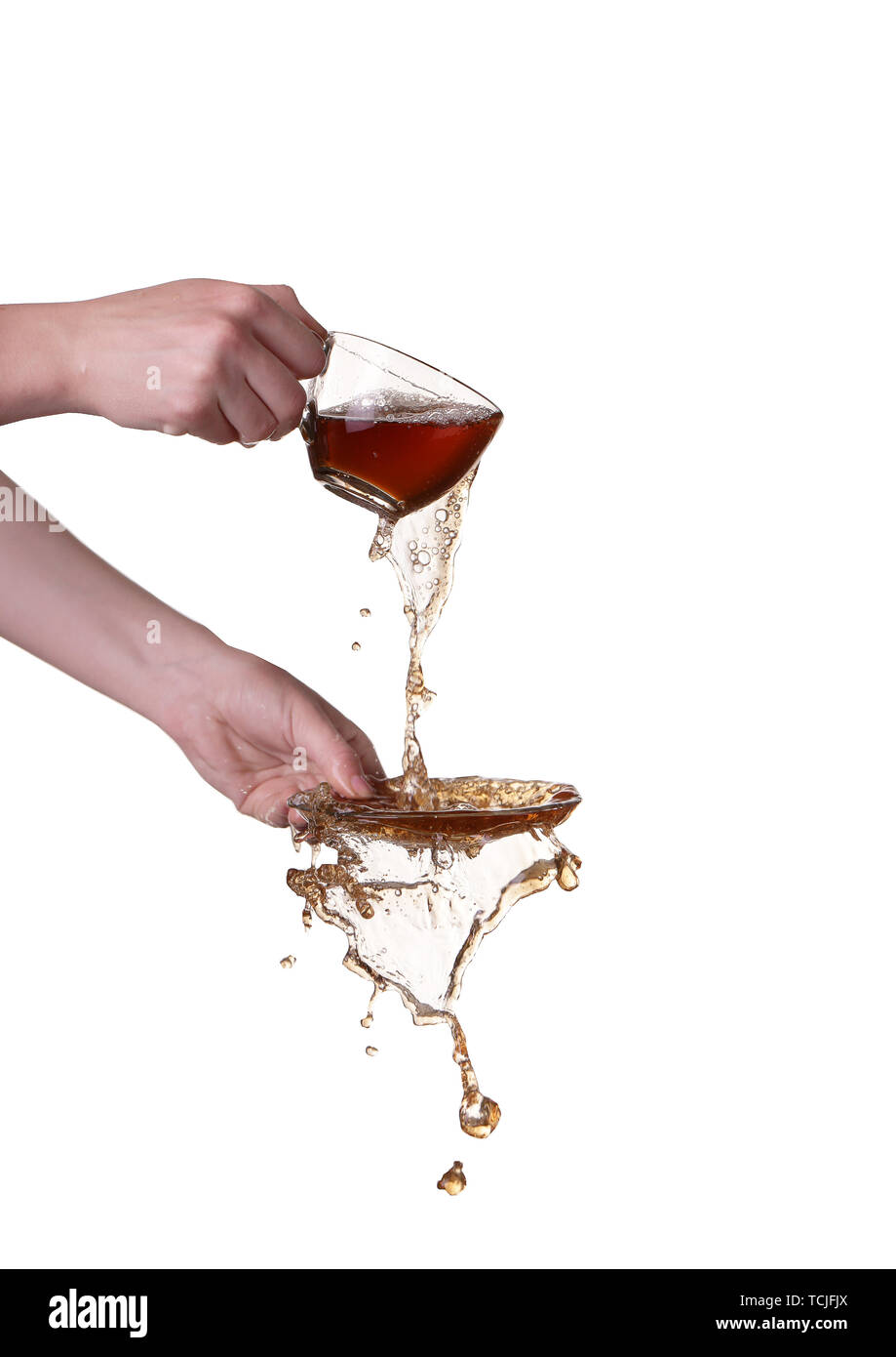 Glass cup of tea with splash Stock Photo - Alamy