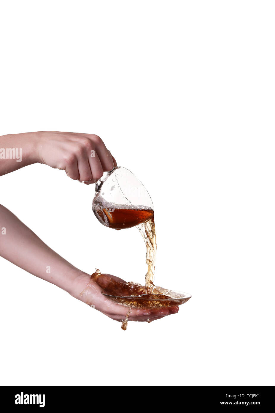 Glass cup of tea with splash Stock Photo - Alamy