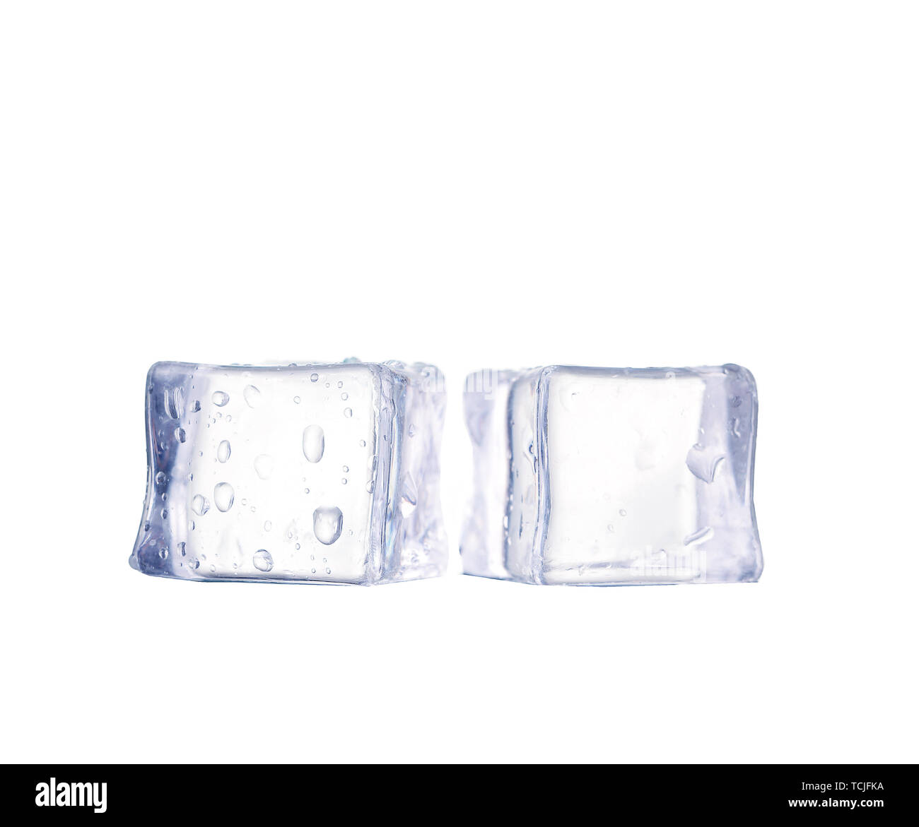 Three ice cubes on white background Stock Photo - Alamy