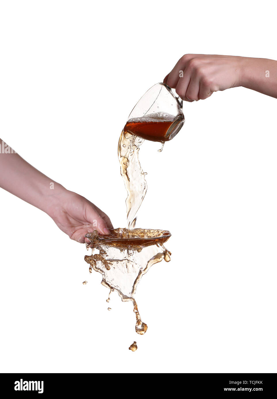 Glass cup of tea with splash Stock Photo - Alamy