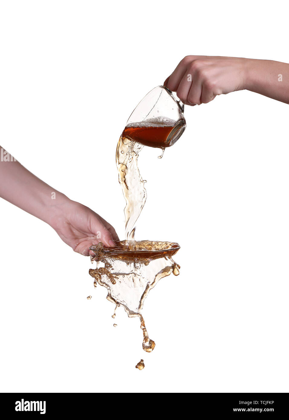 Glass cup of tea with splash Stock Photo - Alamy