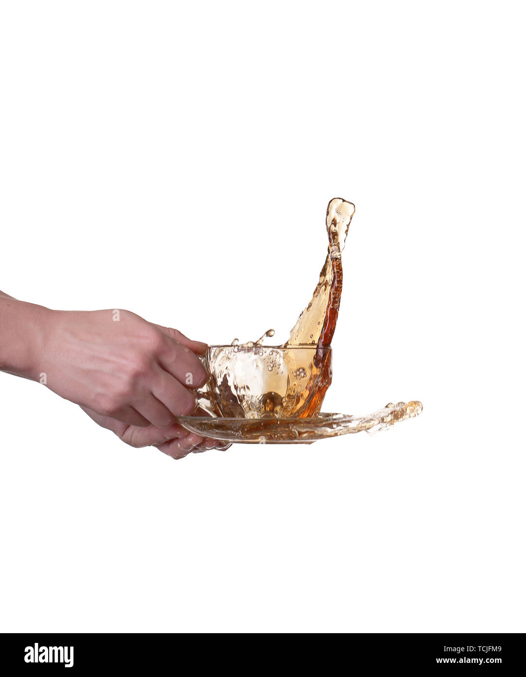 Glass cup of tea with splash Stock Photo - Alamy