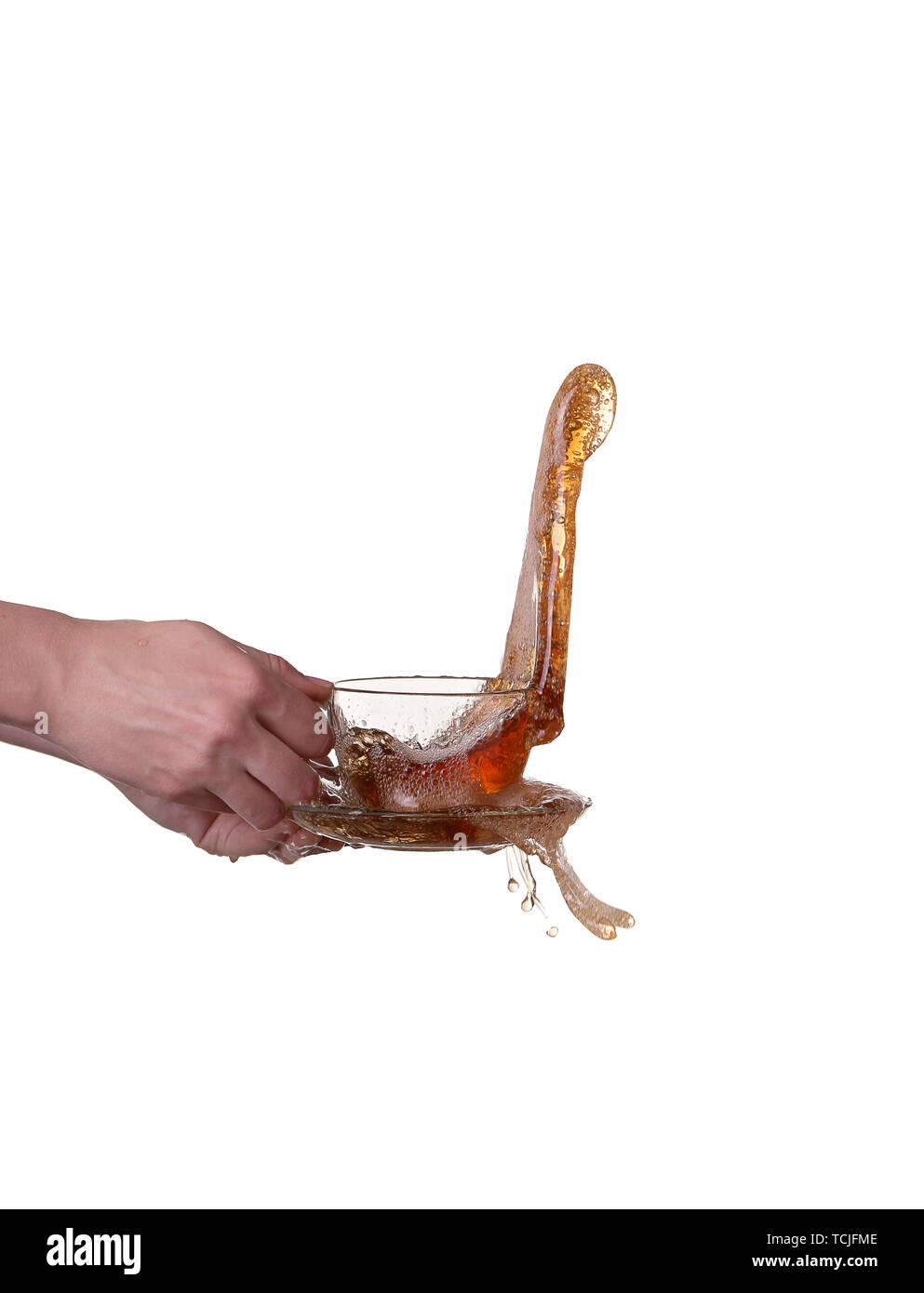 Glass cup of tea with splash Stock Photo - Alamy