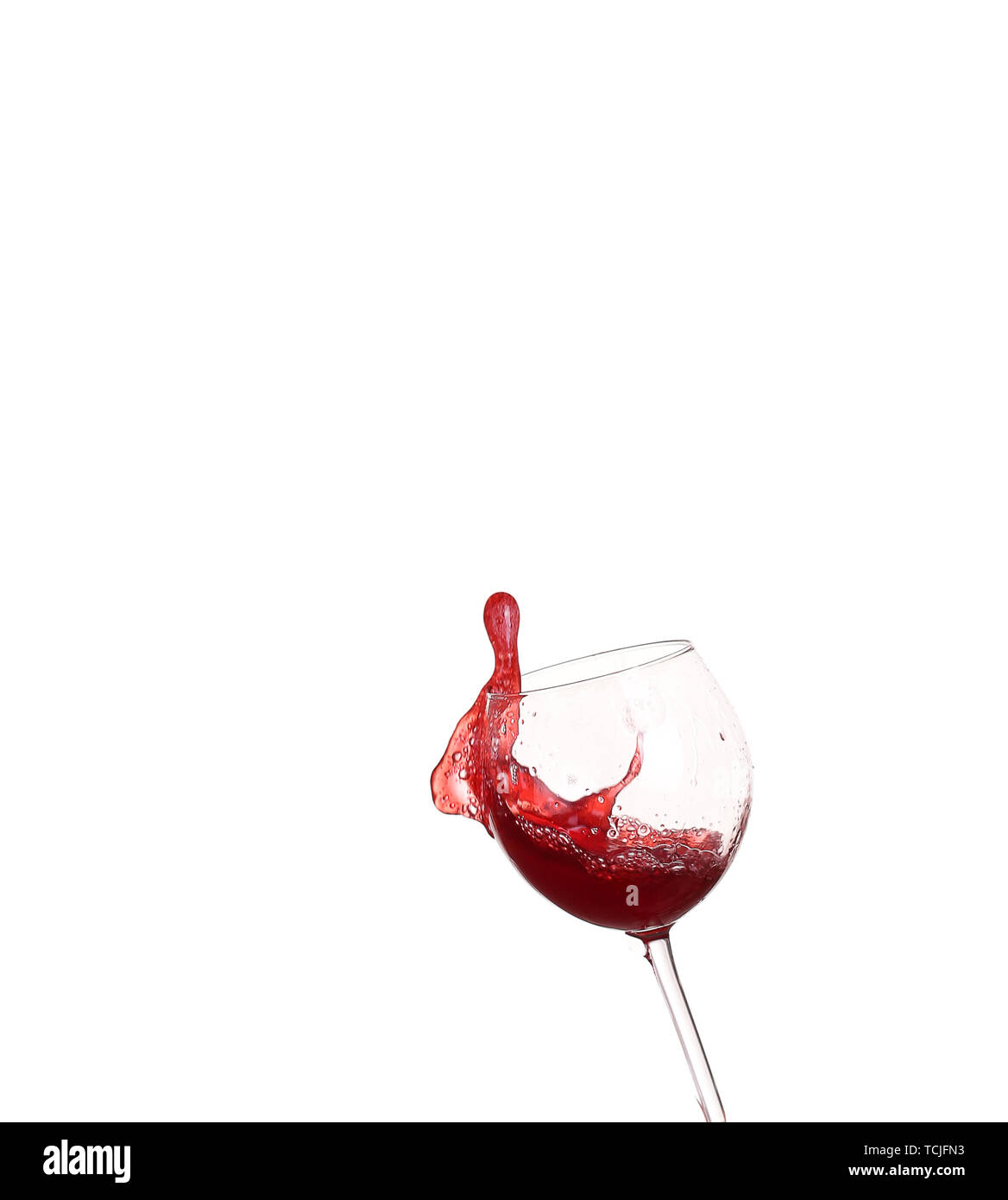 Red wine splashing from glass, isolated on white background Stock Photo - Alamy