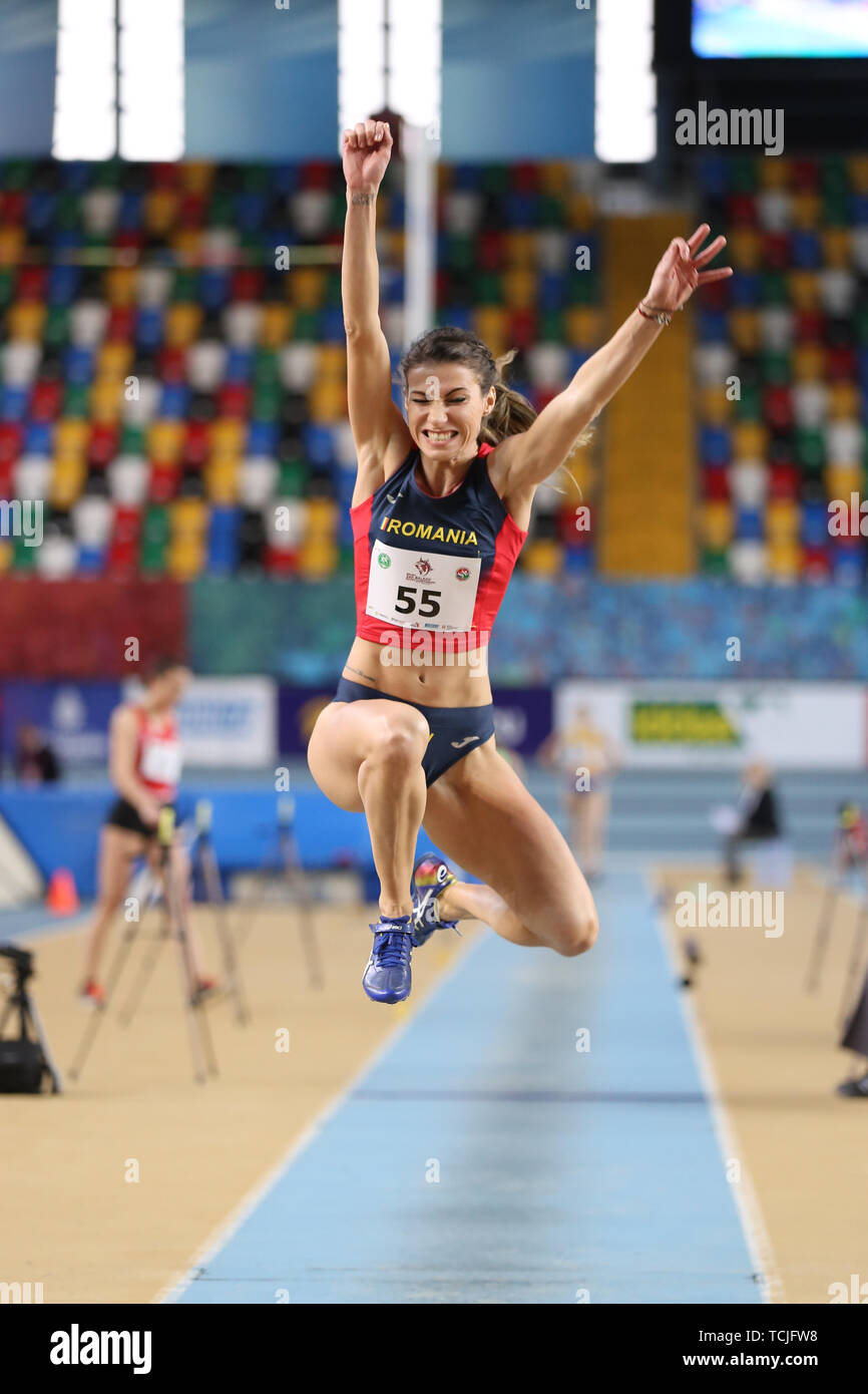 ISTANBUL, TURKEY - FEBRUARY 16, 2019: Undefined athlete triple jumping ...