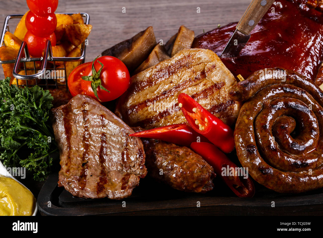 Grilled meat mix plate - beef, pork and chicken Stock Photo - Alamy