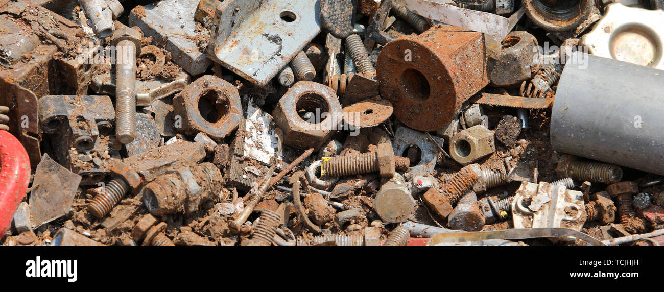 bolts and other rusted object in the junkyard Stock Photo - Alamy