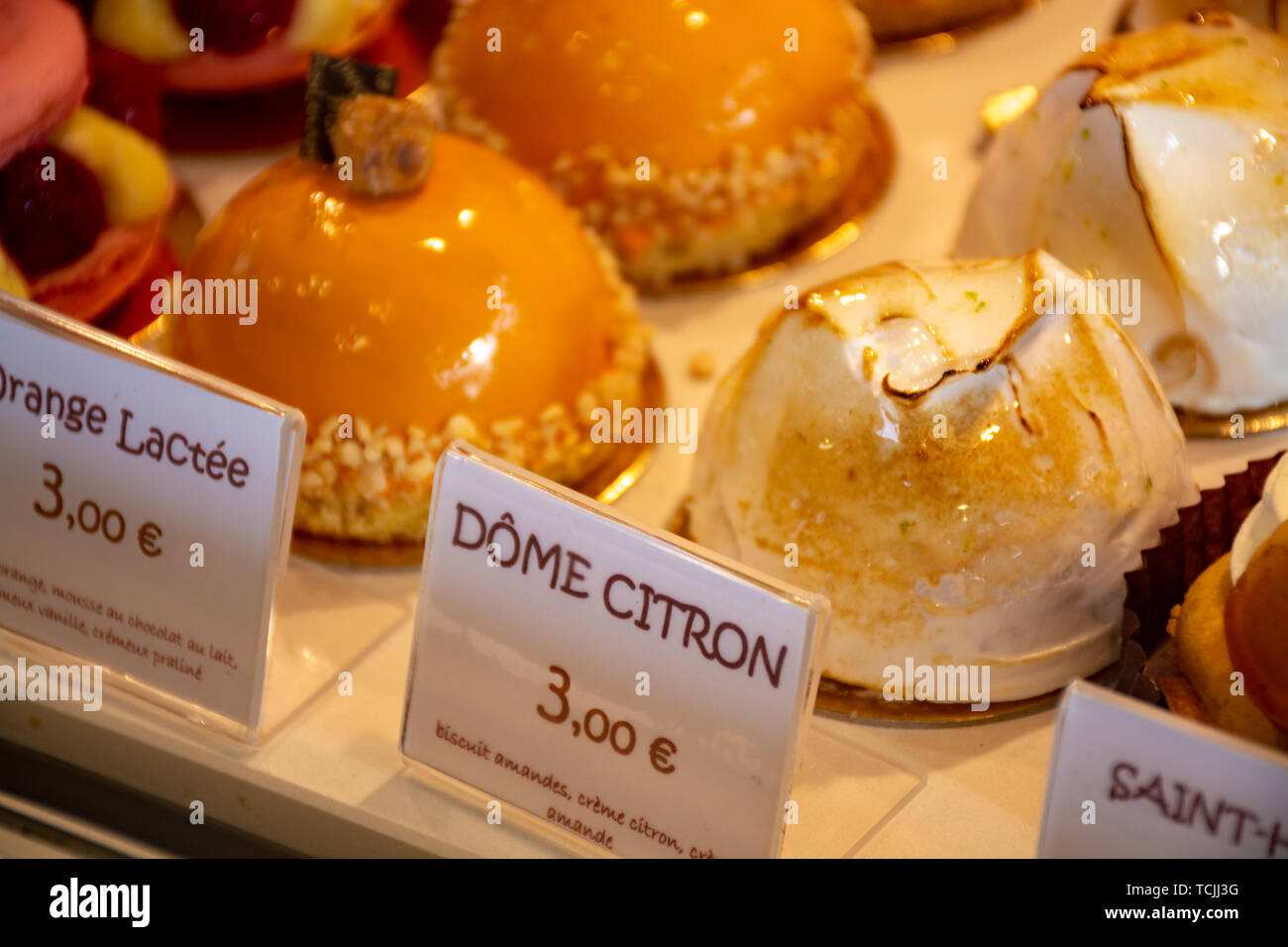 Freshly baked stuffed sweet pastries Orange Lactee and Dome Citron with ...