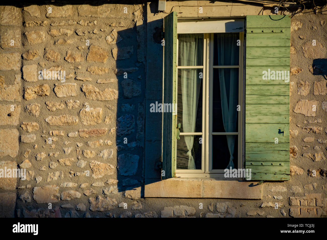View on window in medieval house in Provence in sun lights during ...