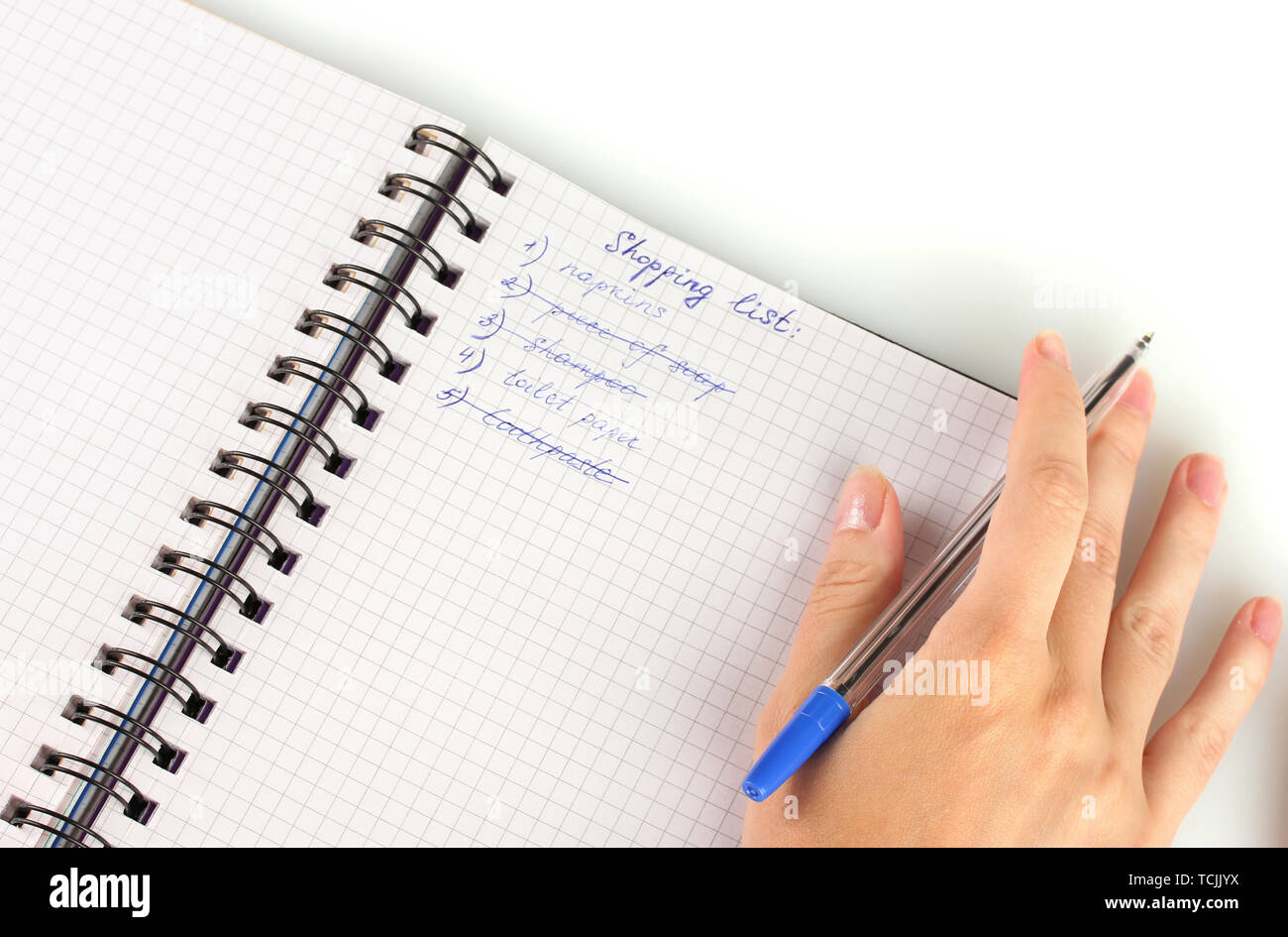 woman's hand holding a notebook with a shopping list close-up Stock ...