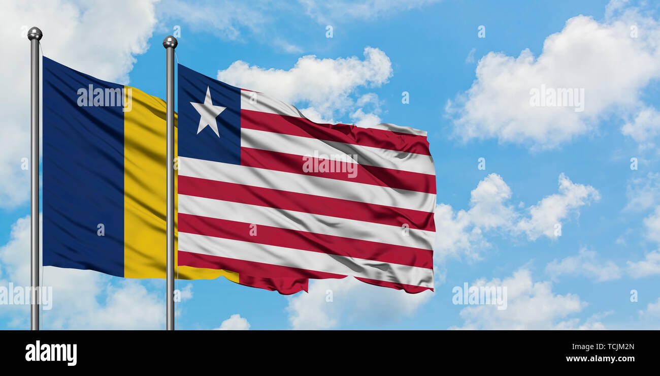 Chad and Liberia flag waving in the wind against white cloudy blue sky ...