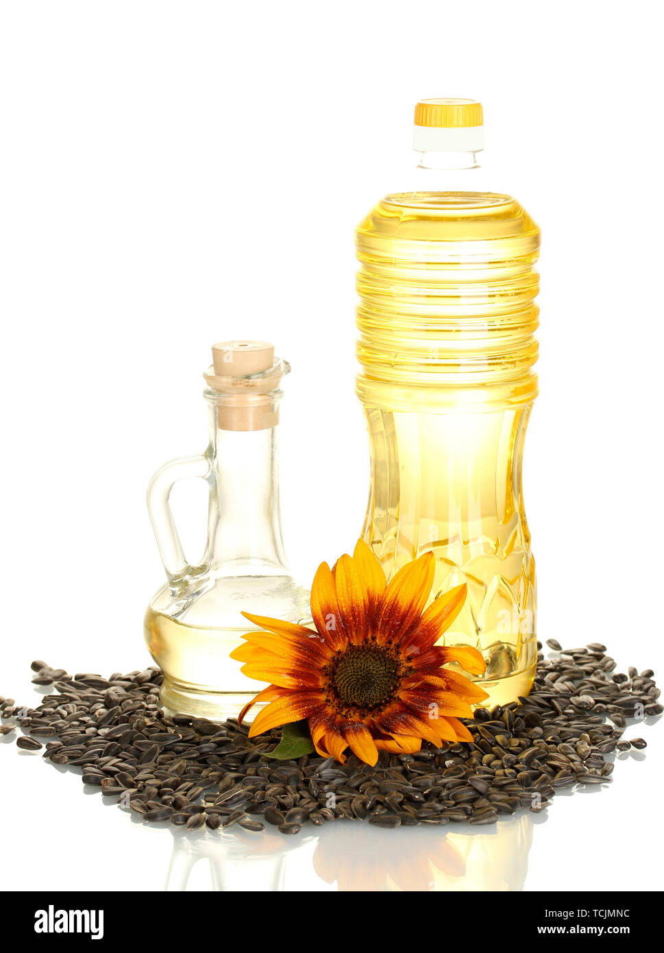 sunflower oil in a plastic bottle and small decanter isolated on white ...