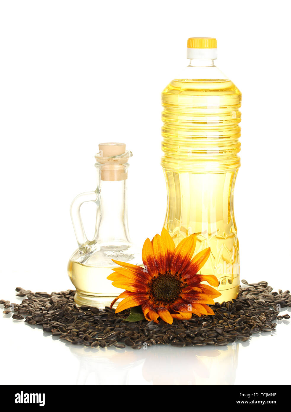 sunflower oil in a plastic bottle and small decanter isolated on white ...