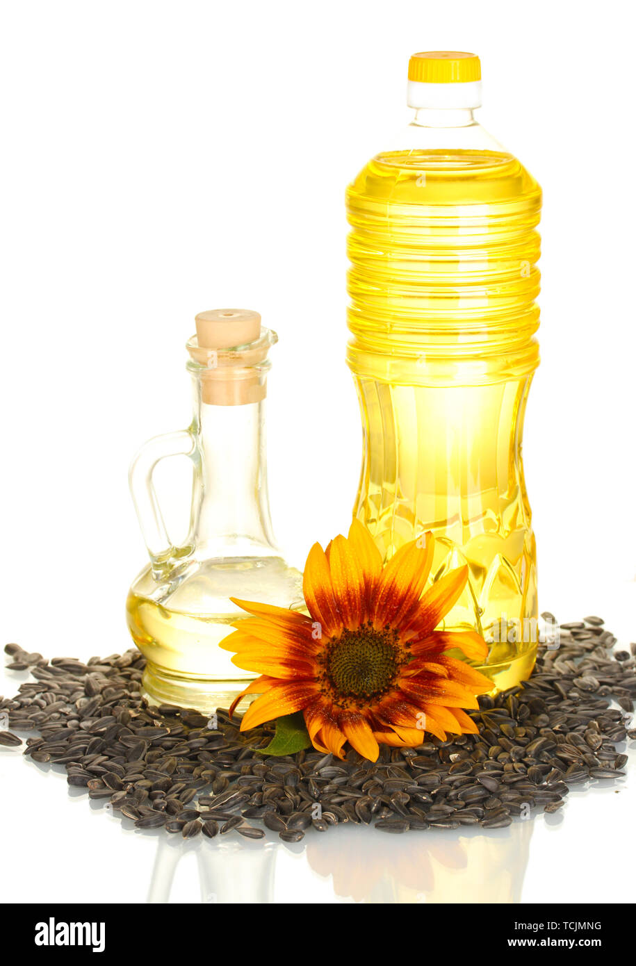 sunflower oil in a plastic bottle and small decanter isolated on white ...