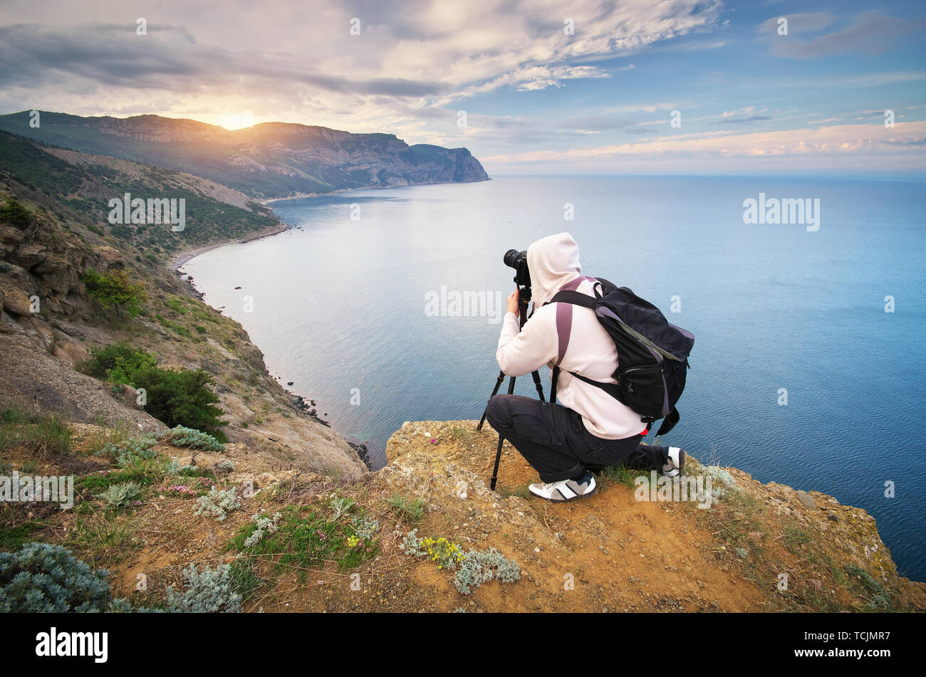 Photograph work in mountain. Job scene Stock Photo - Alamy