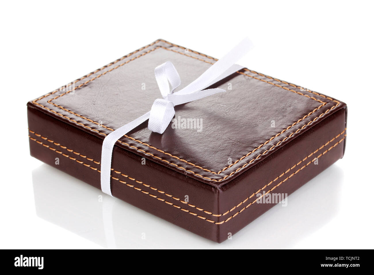 Brown box with ribbon isolated on white Stock Photo - Alamy
