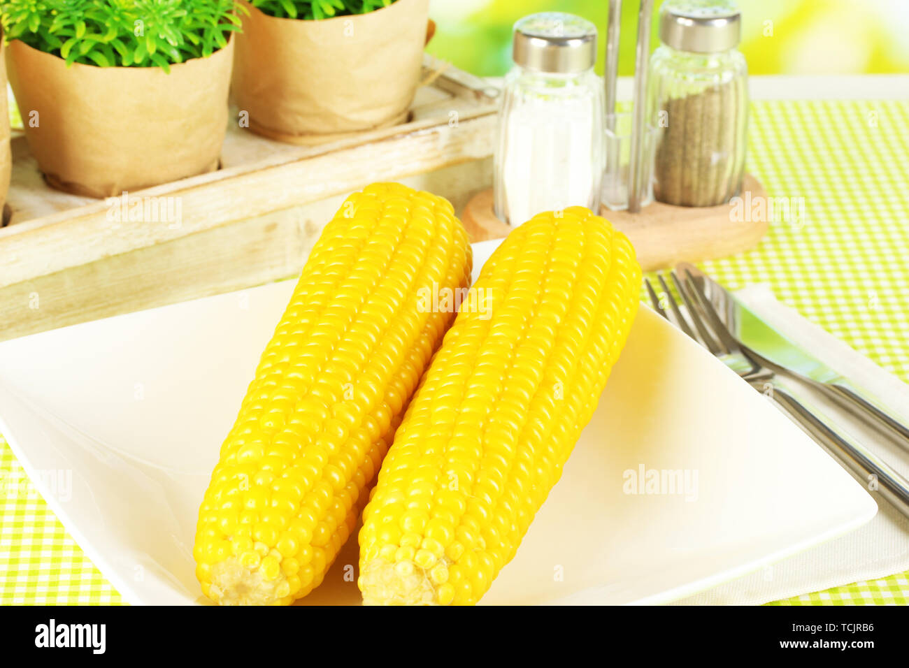 boiled corn and flowers on a background of nature Stock Photo - Alamy