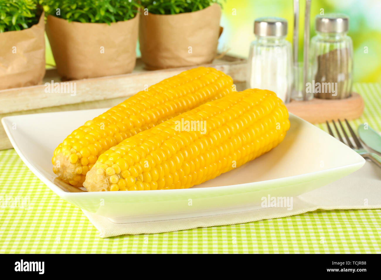 boiled corn and flowers on a background of nature Stock Photo - Alamy