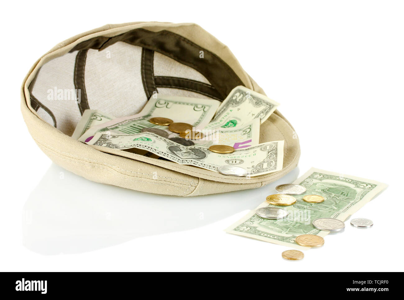 cap with money on a white background Stock Photo - Alamy