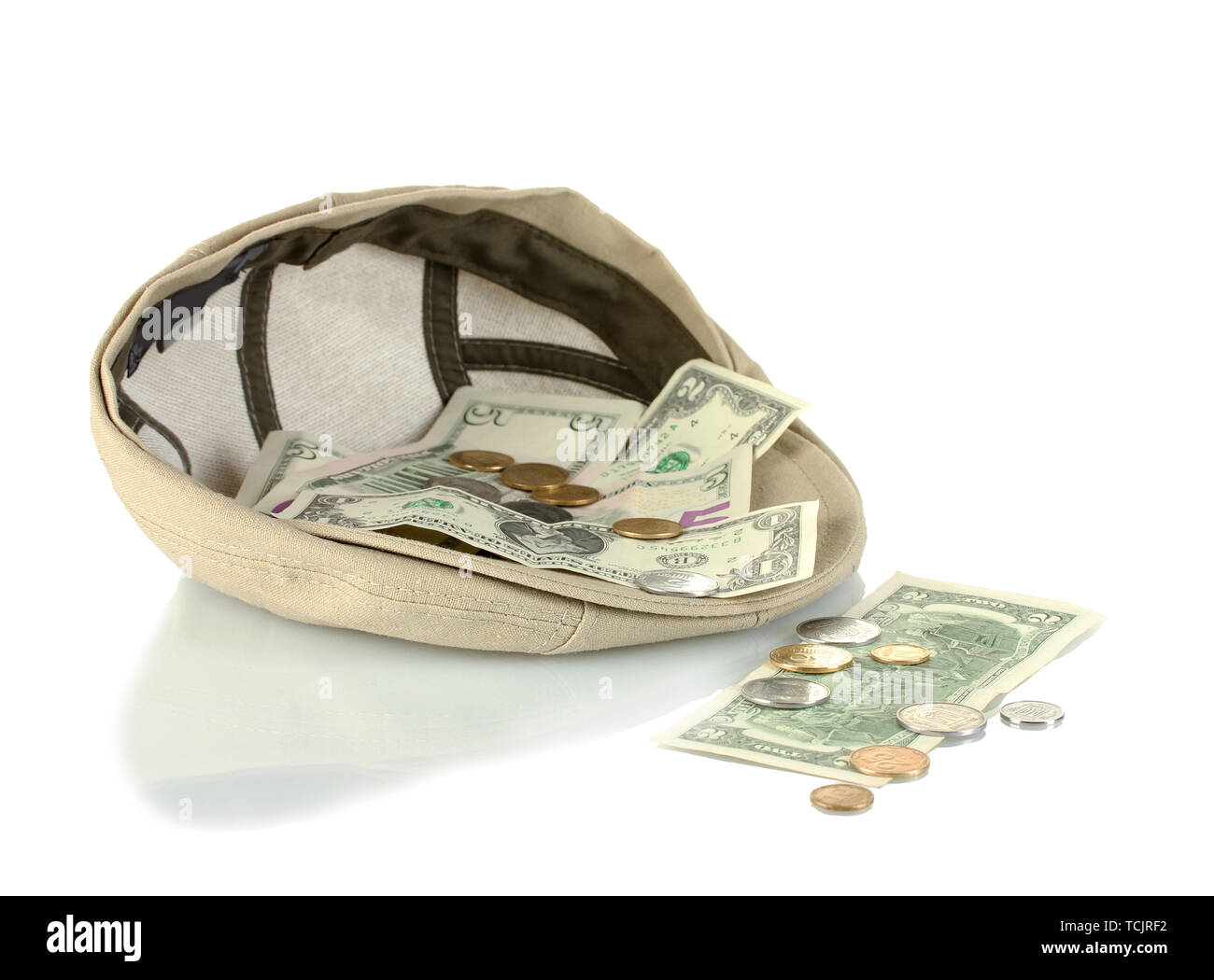 cap with money on a white background Stock Photo - Alamy