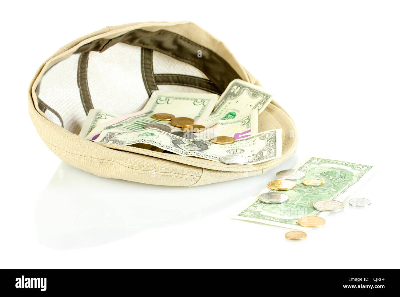 cap with money on a white background Stock Photo - Alamy
