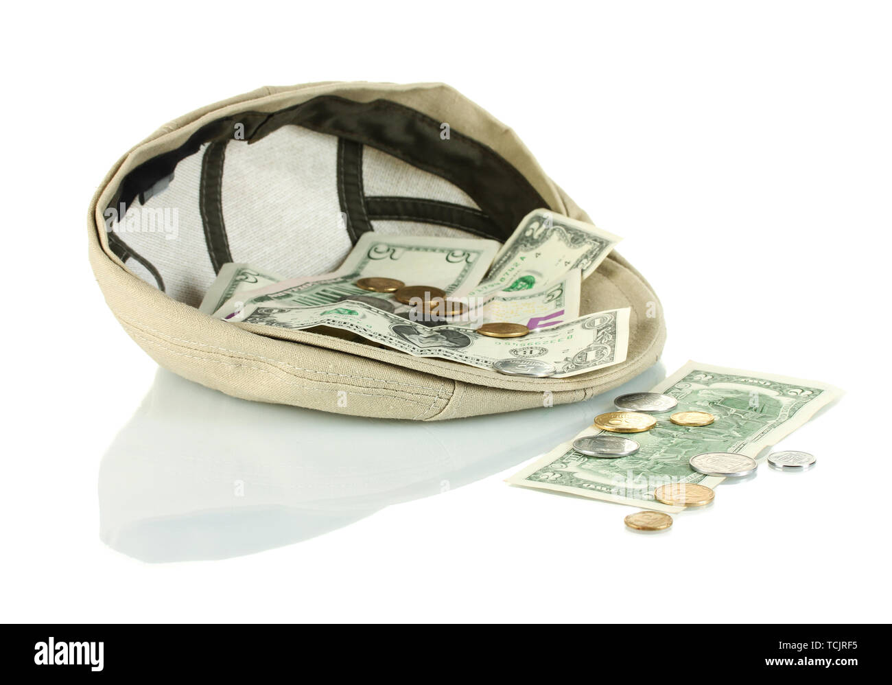 cap with money on a white background Stock Photo - Alamy