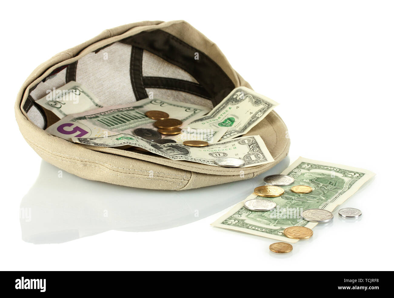 cap with money on a white background Stock Photo - Alamy