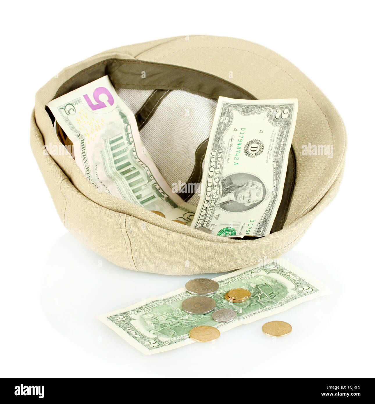 cap with money on a white background Stock Photo - Alamy