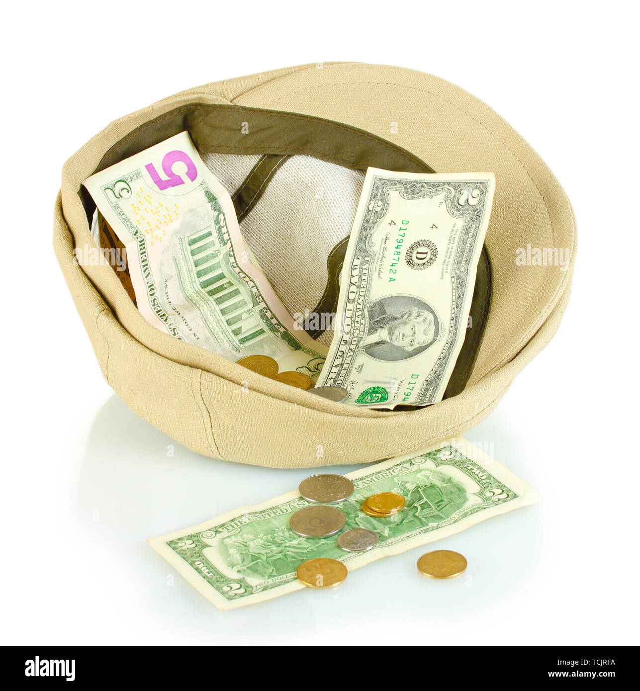 cap with money on a white background Stock Photo - Alamy
