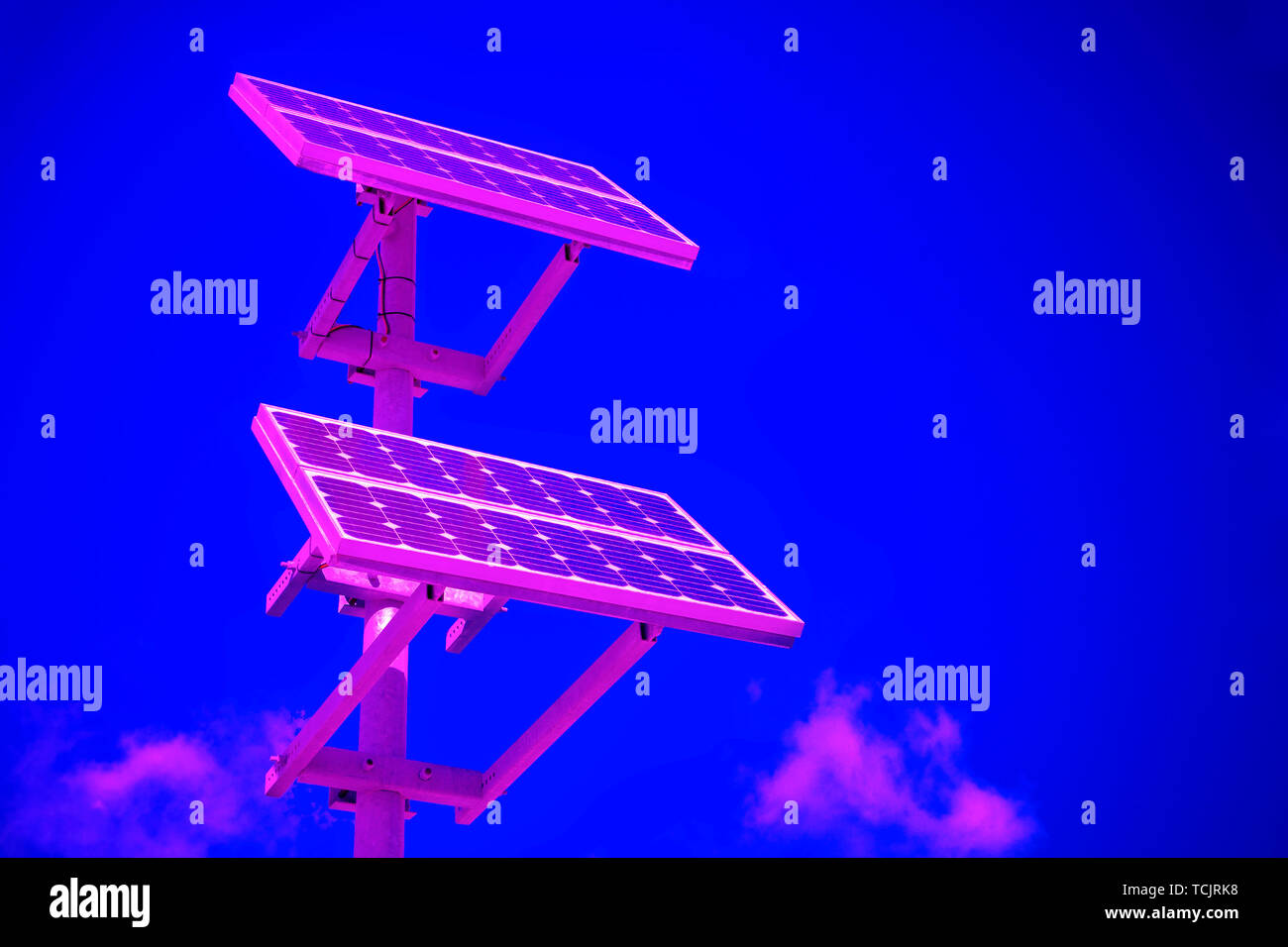 Neon colored Solar panels with copy space background. Renewable Energy ...