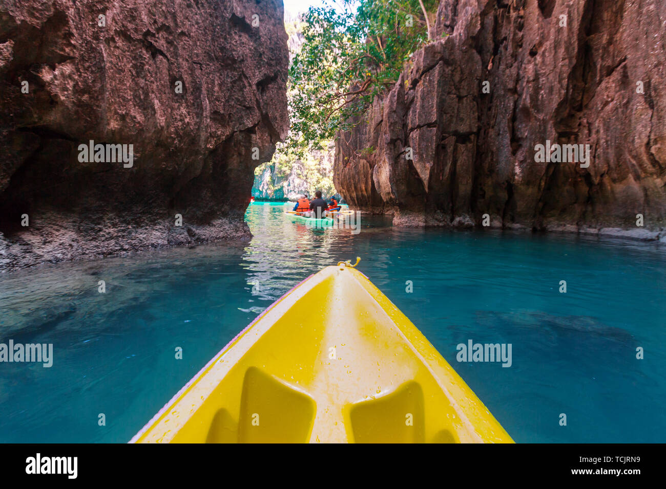 Kayak in the island lagoon between mountains. Kayaking journey in El ...