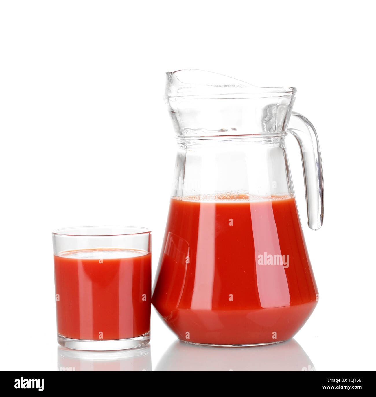 Tomato juice in pitcher and glass isolated on white Stock Photo - Alamy