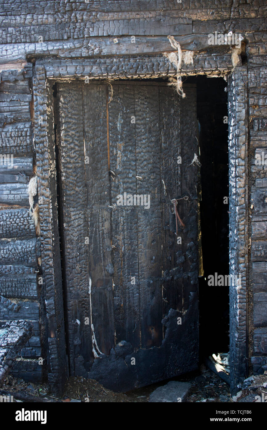Black background. Burnt wooden Board texture. Burned scratched hardwood ...