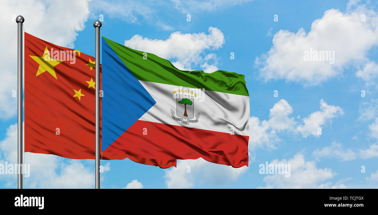 China and Equatorial Guinea flag waving in the wind against white ...