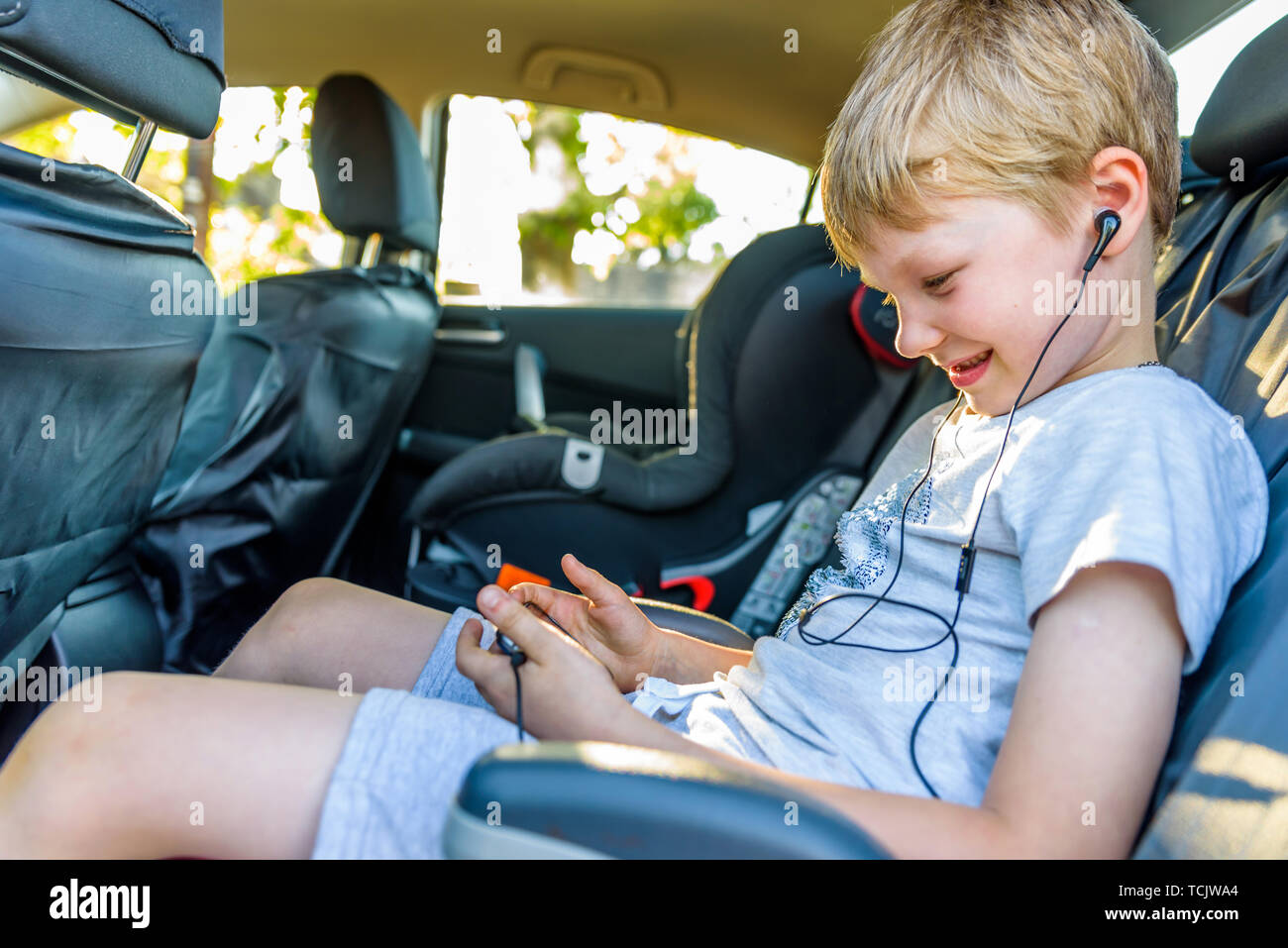 Sad boy inside car hi-res stock photography and images - Alamy