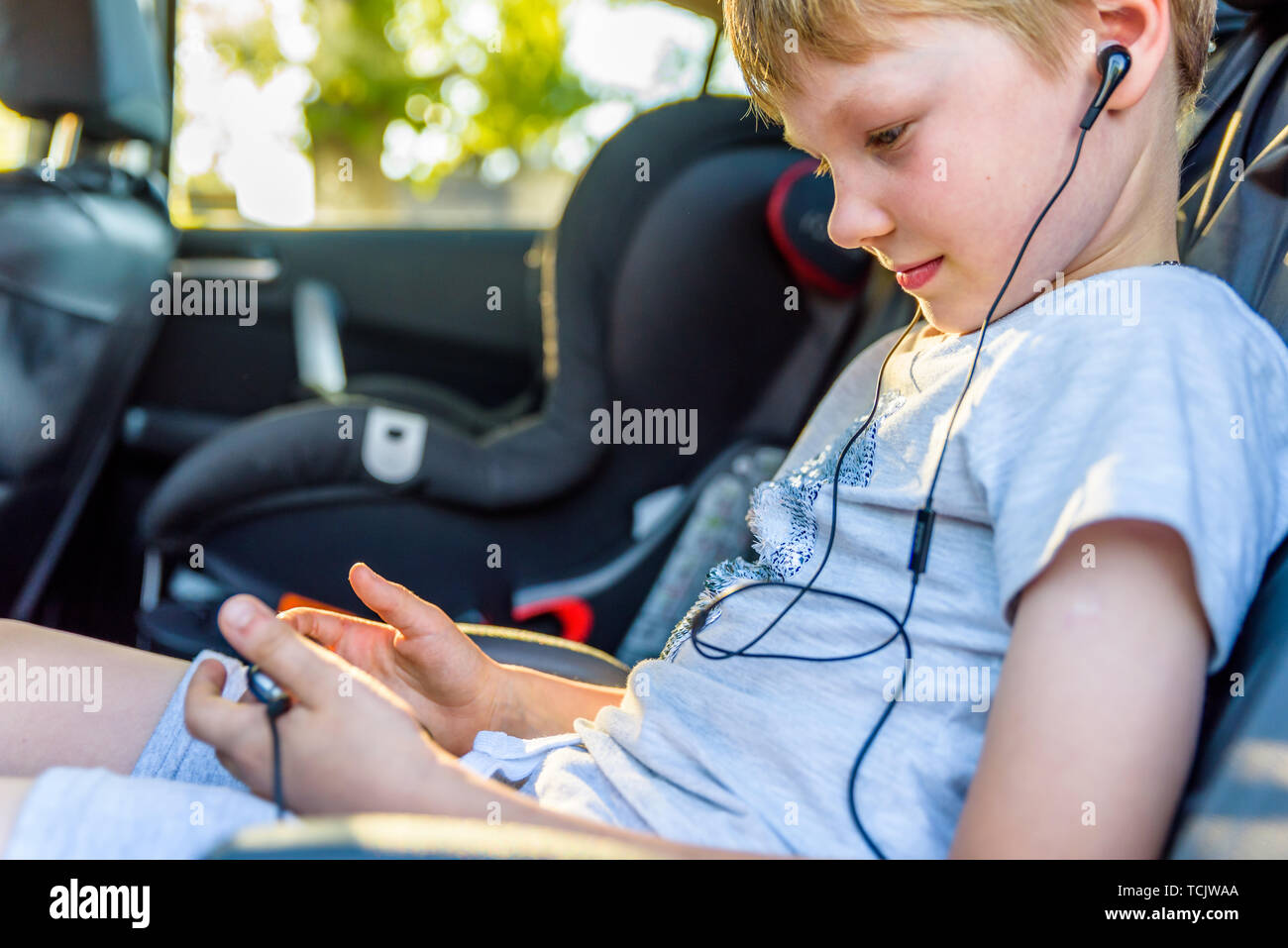 Sad boy inside car hi-res stock photography and images - Alamy