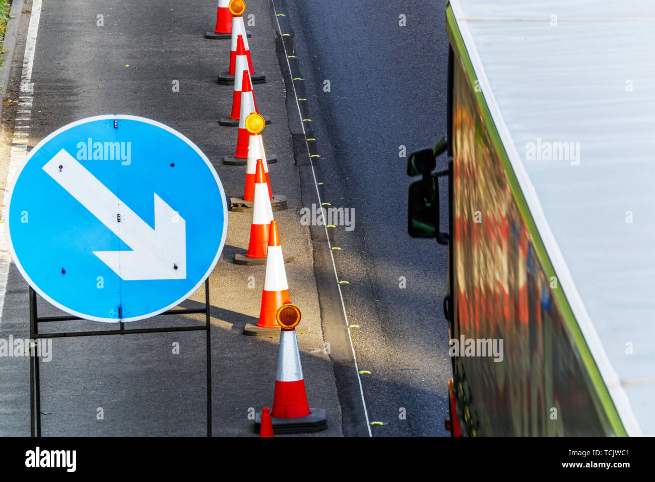 UK Road Services Roadworks Cones and directional Signs on motorway ...