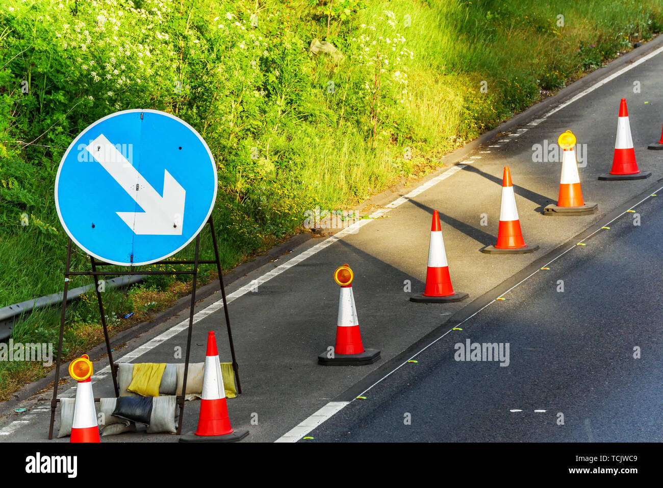 UK Road Services Roadworks Cones and directional Signs on motorway ...
