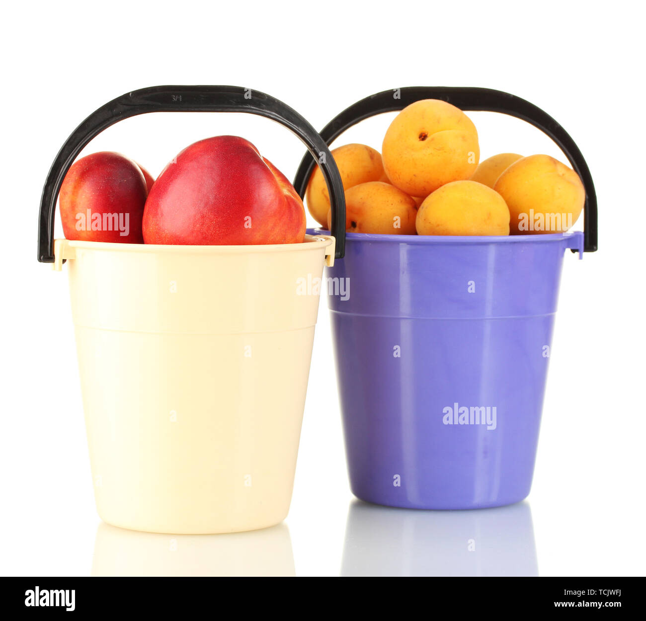 Ripe fruit in plastic buckets isolated on white Stock Photo - Alamy