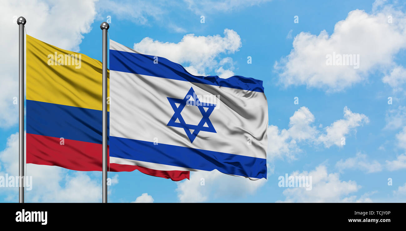 Colombia and Israel flag waving in the wind against white cloudy blue ...