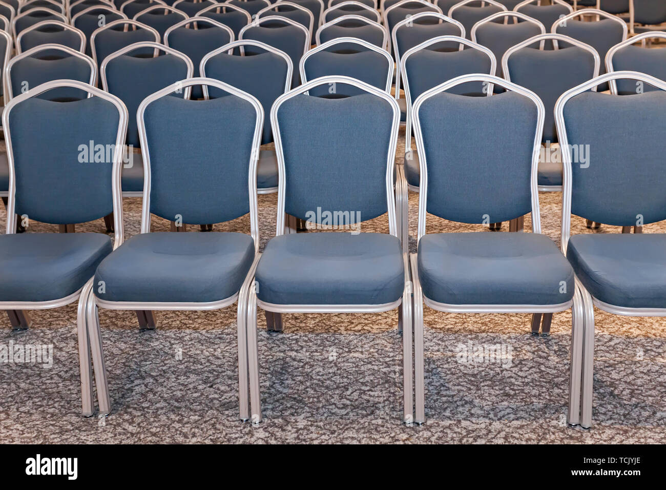 Group of empty blue chairs in modern conference hall - presentation ...