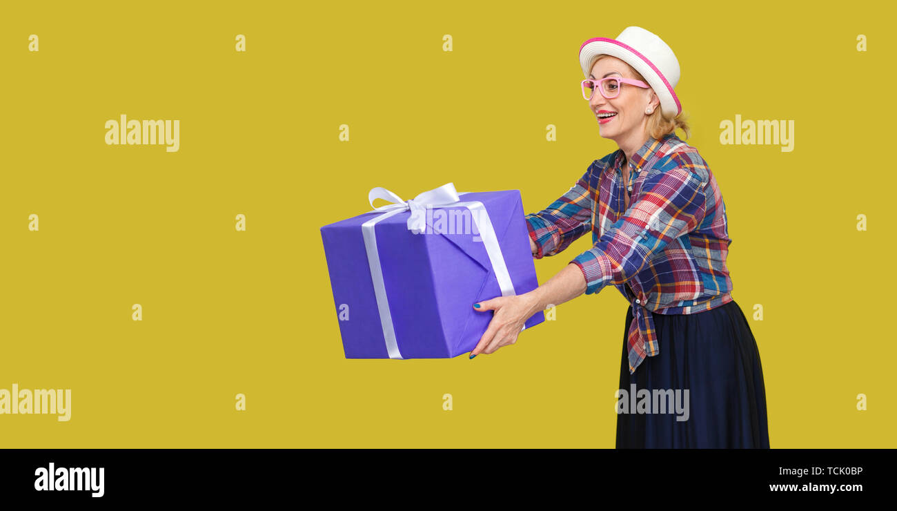Side view portrait of happy beautiful fancy grandma in white hat and in ...