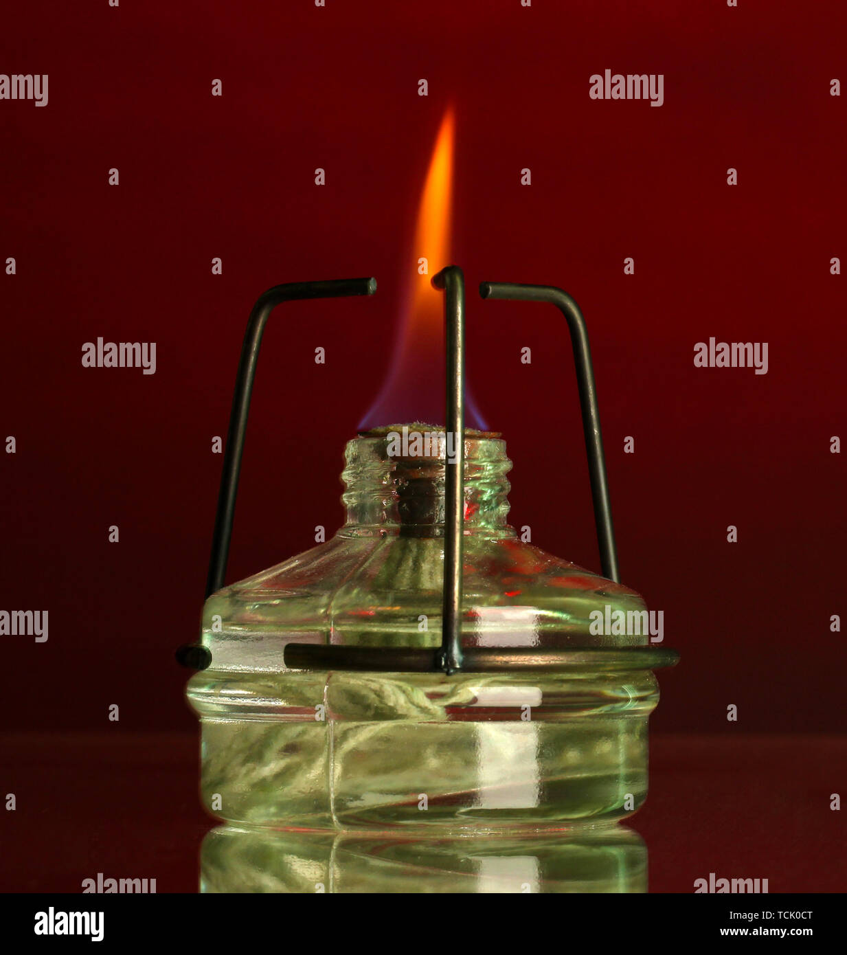 spiritlamp on red background Stock Photo - Alamy