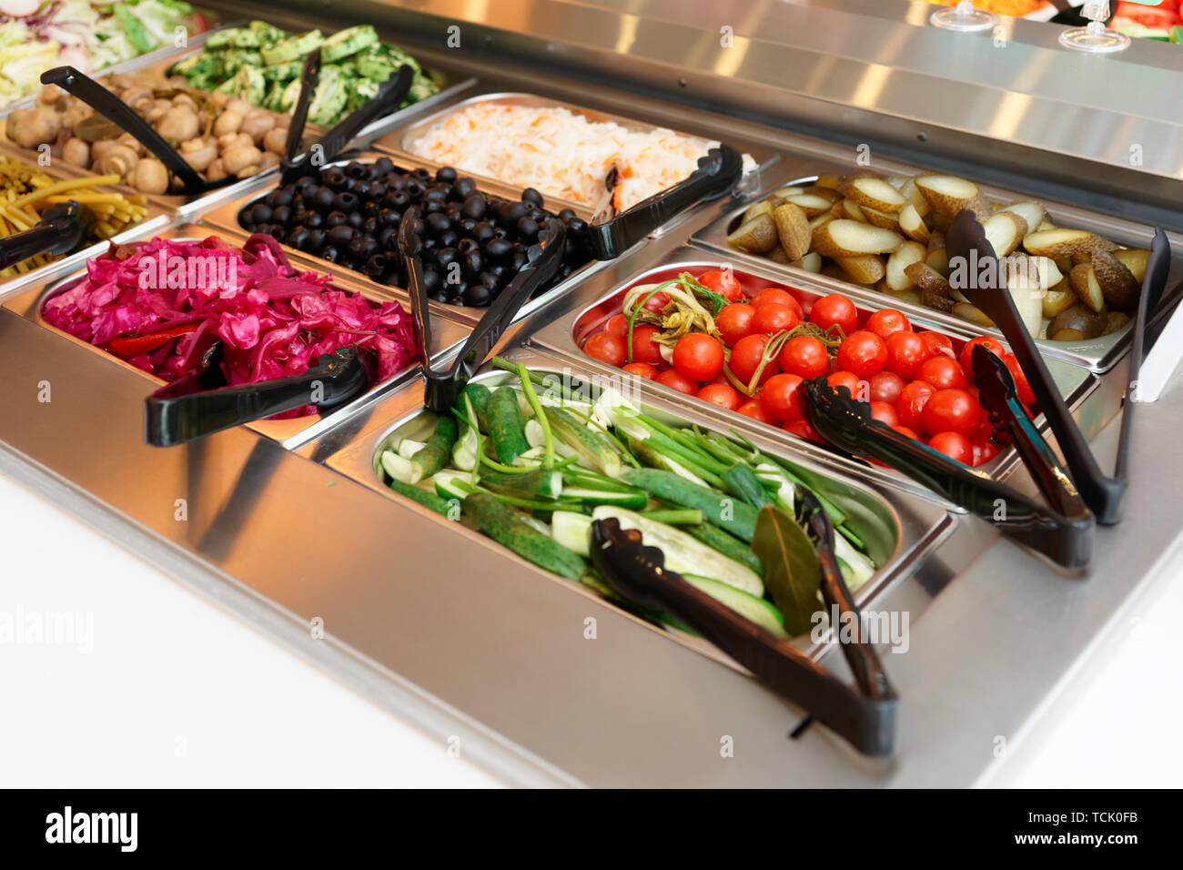 Pickled vegetables on self service restaurant counter Stock Photo - Alamy