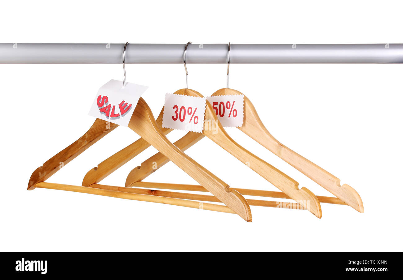 wooden clothes hangers as sale symbol isolated on white Stock Photo - Alamy