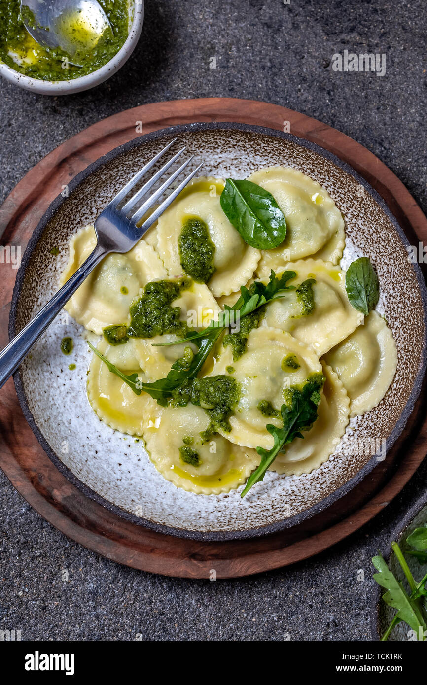 Italian spinach ricotta ravioli, Top view, black background, copy space ...