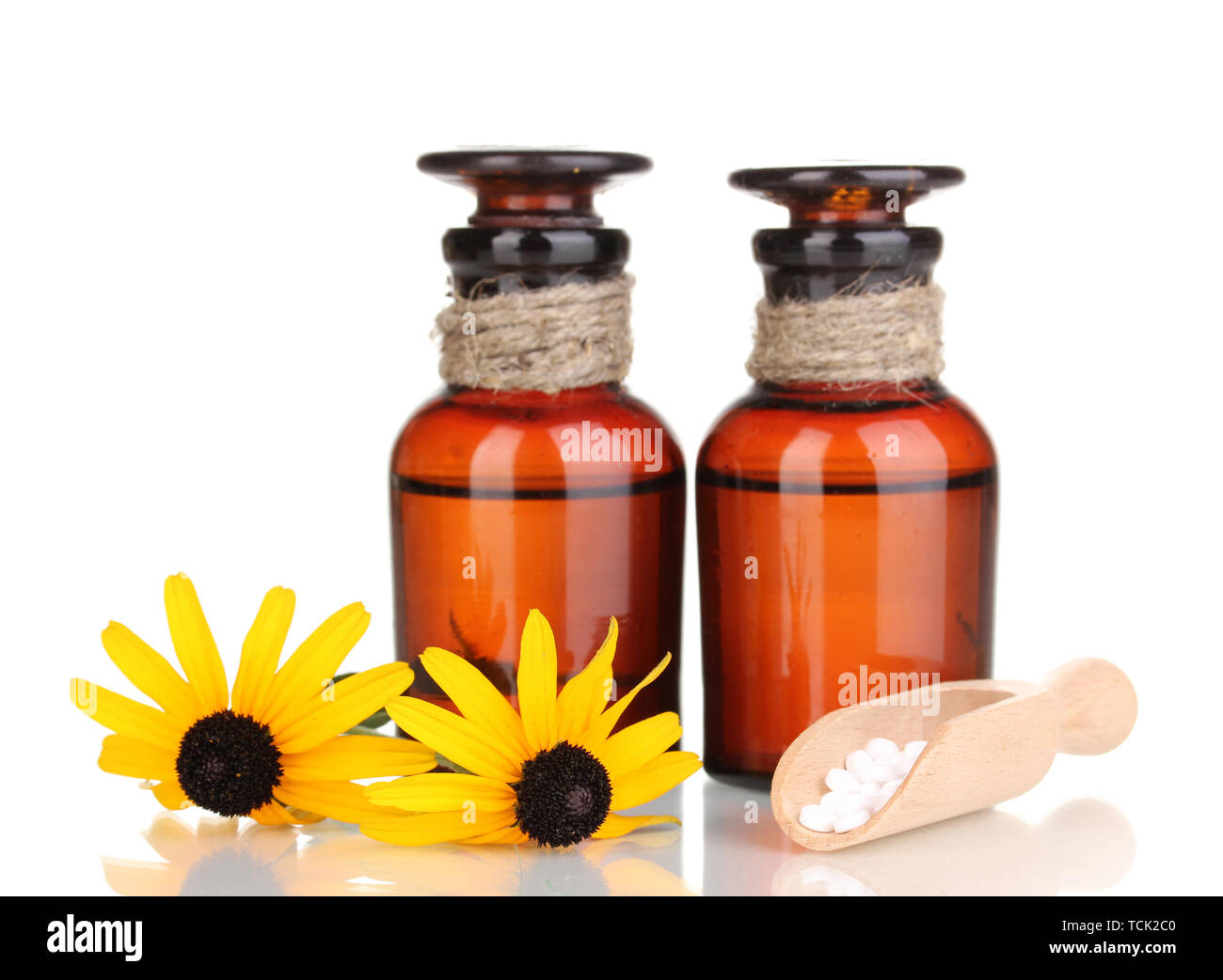 medicine bottles with tablets and flowers isolated on white Stock Photo ...
