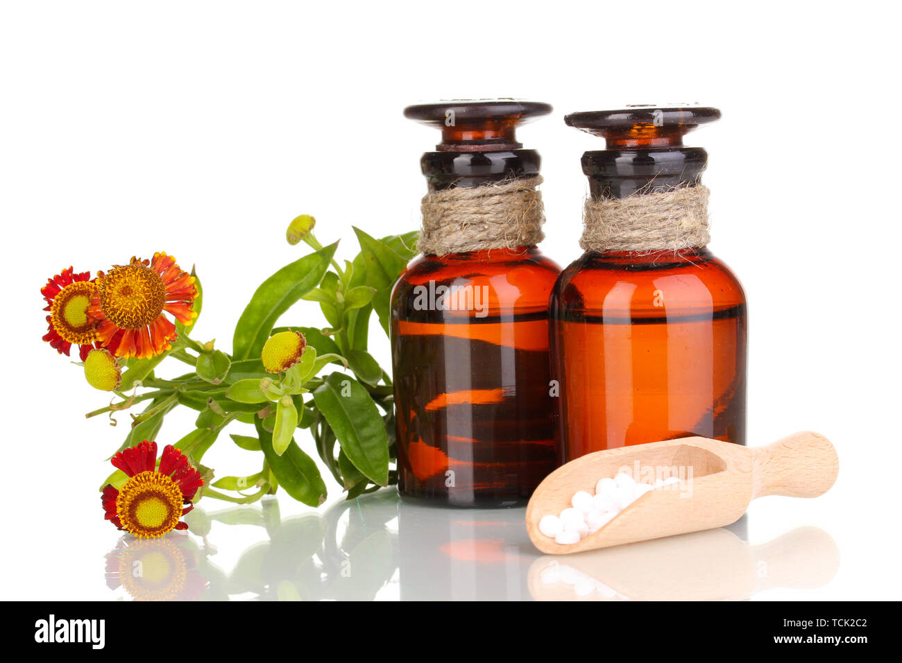 medicine bottles with tablets and flowers isolated on white Stock Photo ...
